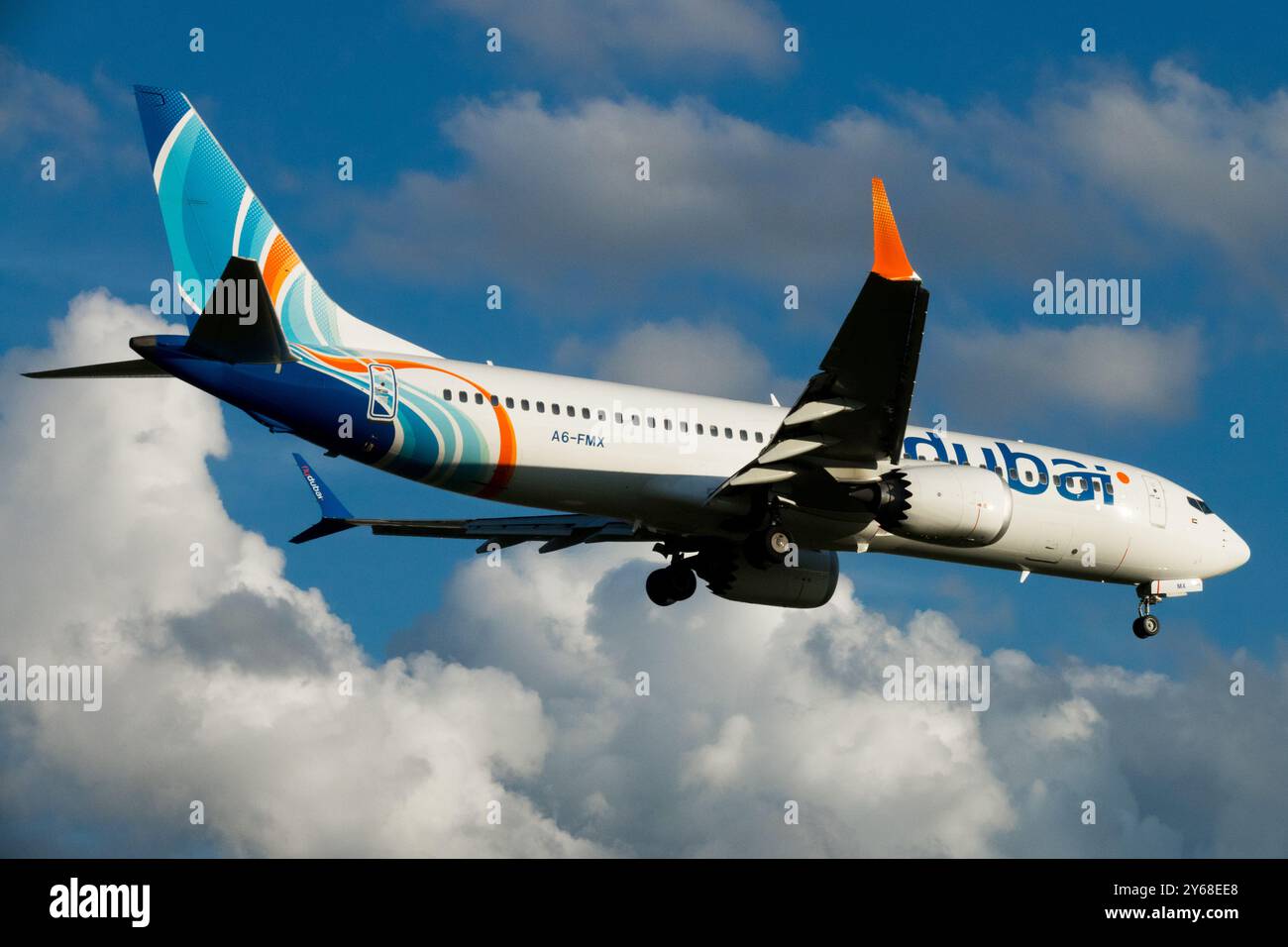 Boeing 737 MAX 8 FlyDubai Plane Aircraft Airplane Jetliner Passenger Jet Airliner Against Blue ...