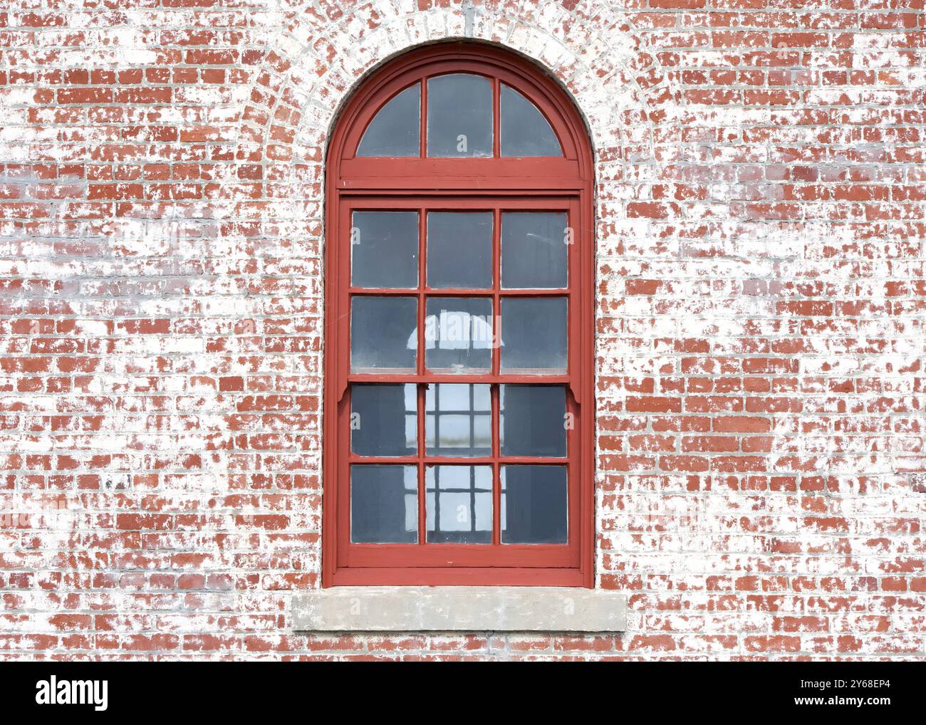 Red framed window inside a window with old red brick facade Stock Photo ...
