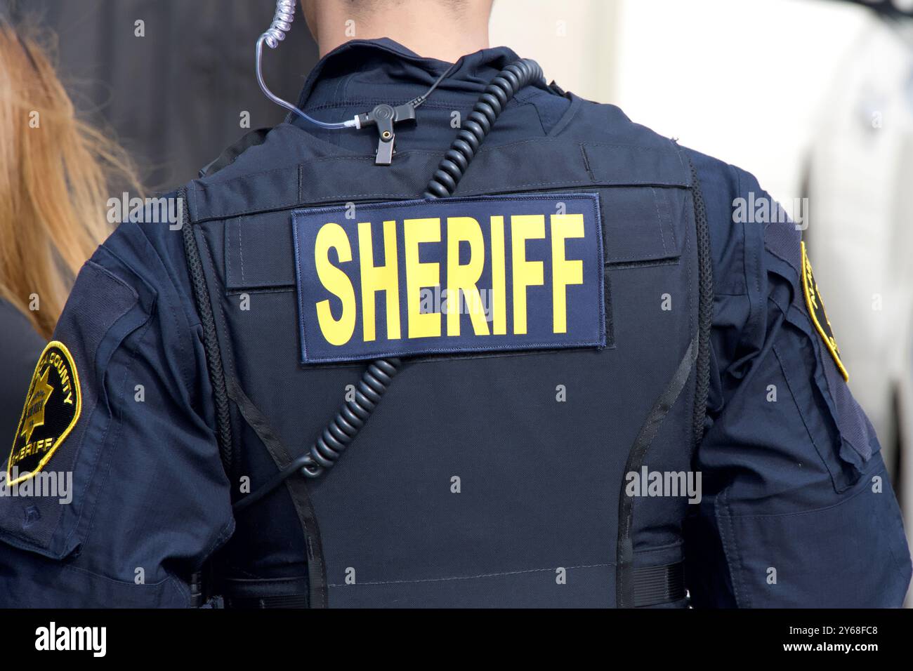 Close up on Sheriff title logo on back of flack jacket Stock Photo - Alamy