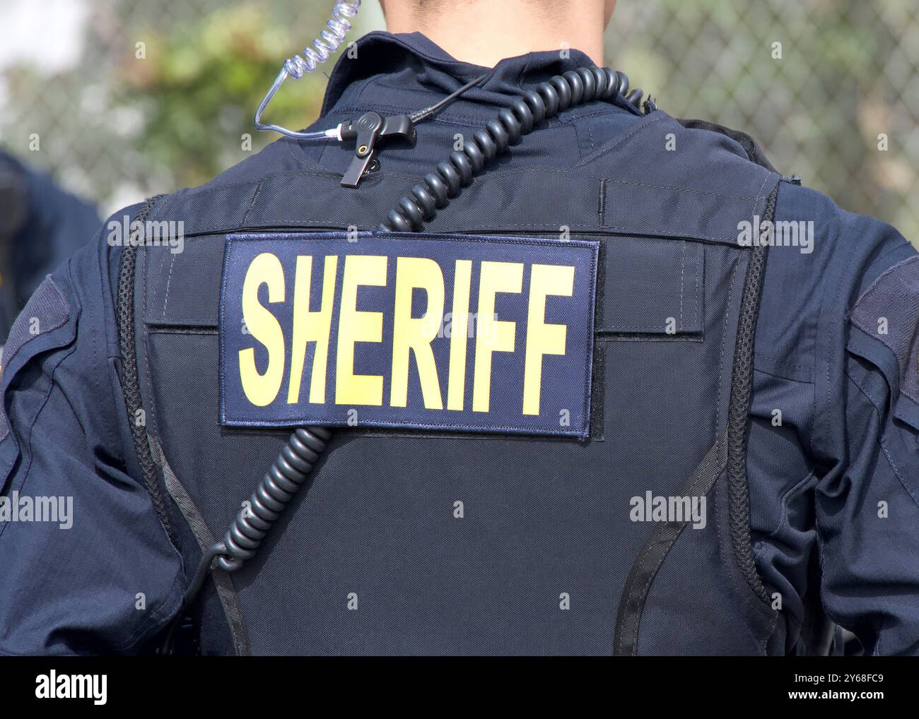 Close up on Sheriff title logo on back of flack jacket Stock Photo - Alamy