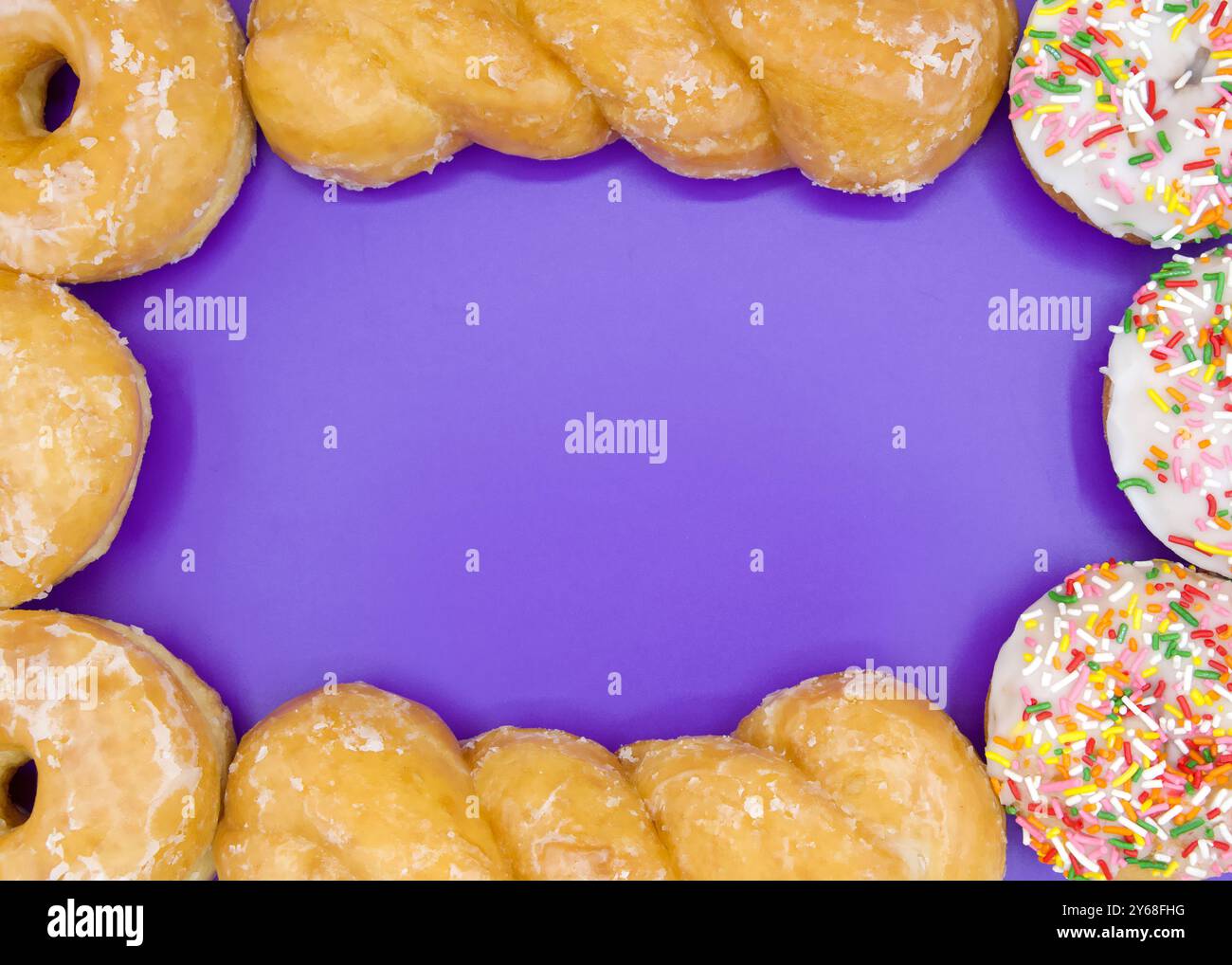 Flat Lay Top View of a variety of donuts forming a border around a ...