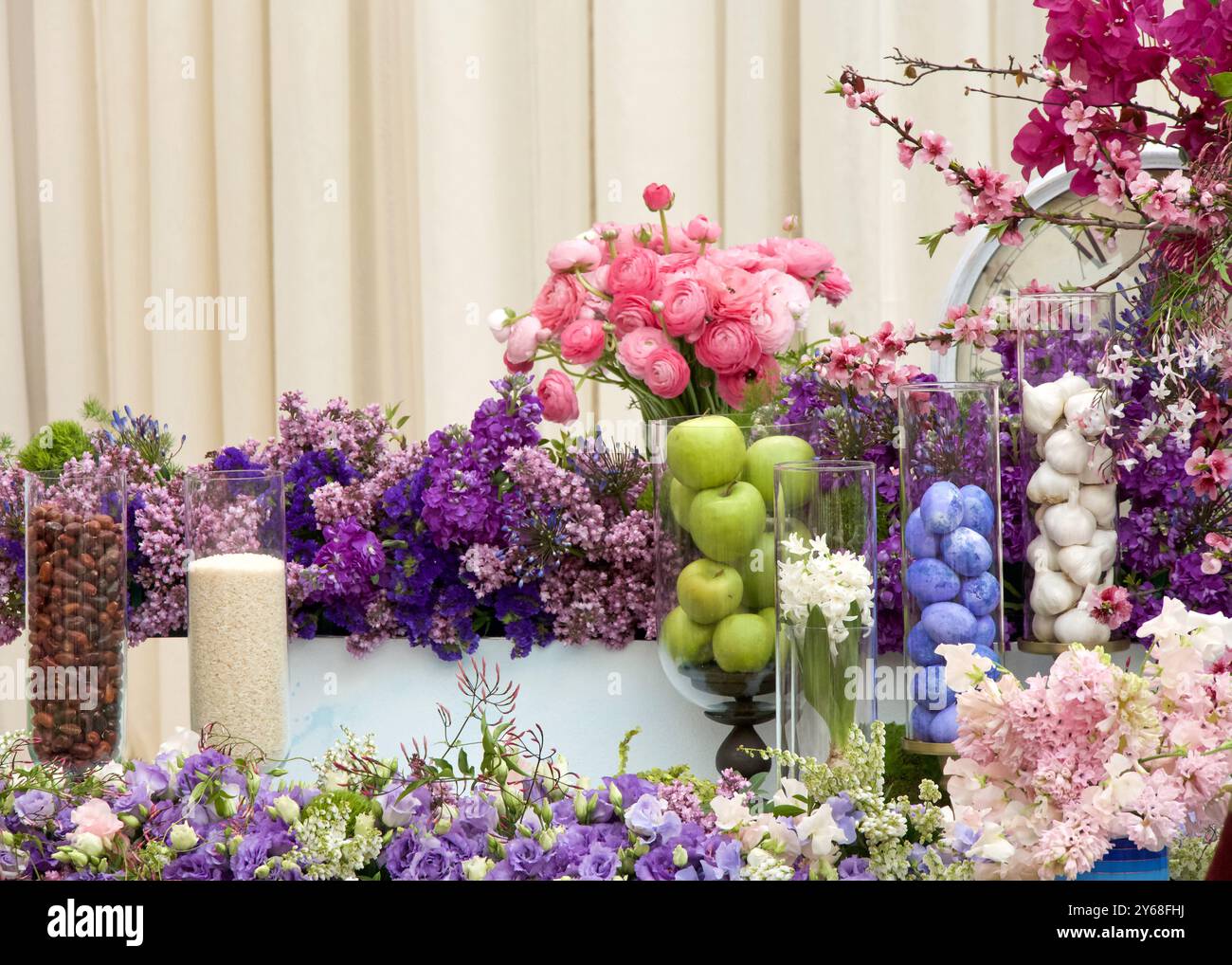 Table setting with rice, fruit and flowers for Nowruz, the Iranian or ...
