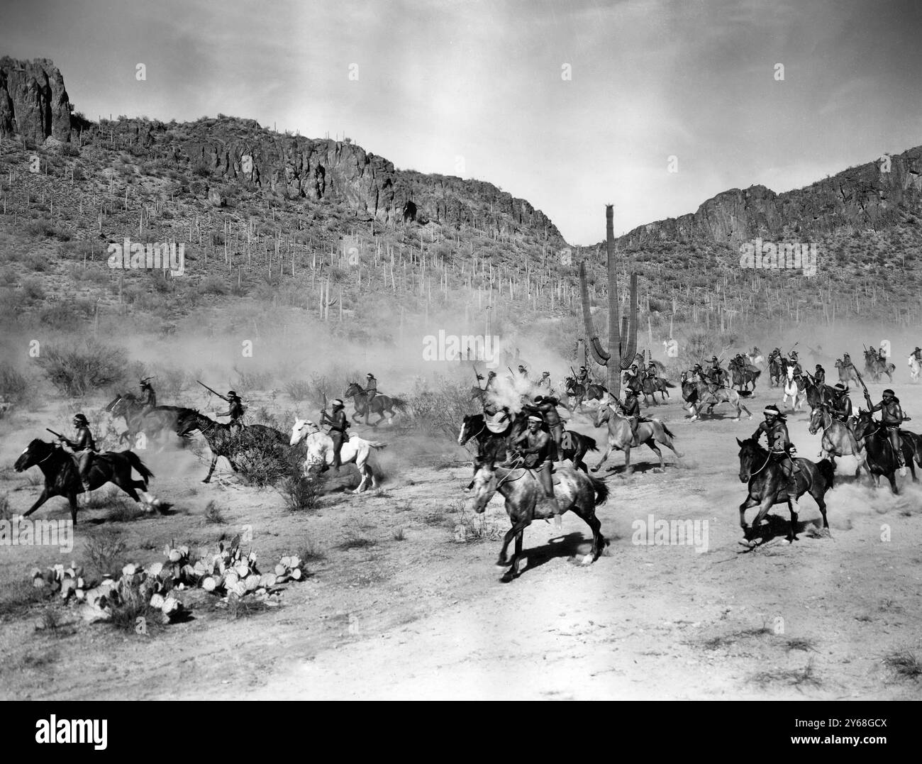 Apache Indians charging on horseback, on-set of the western film ...