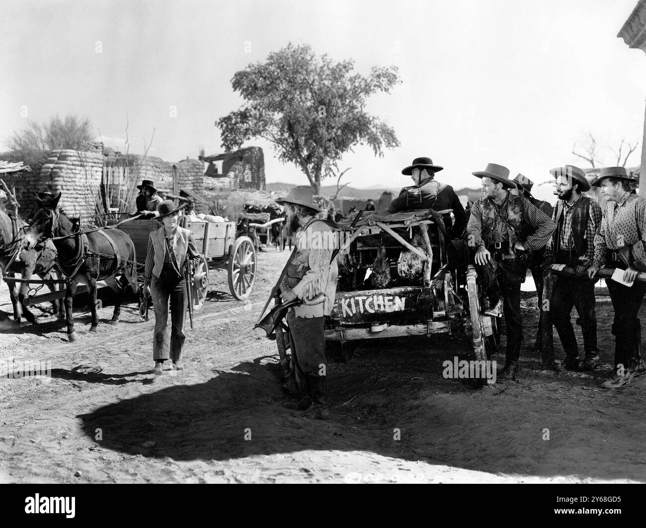 Jean Arthur (standing left with rifle), on-set of the western film ...