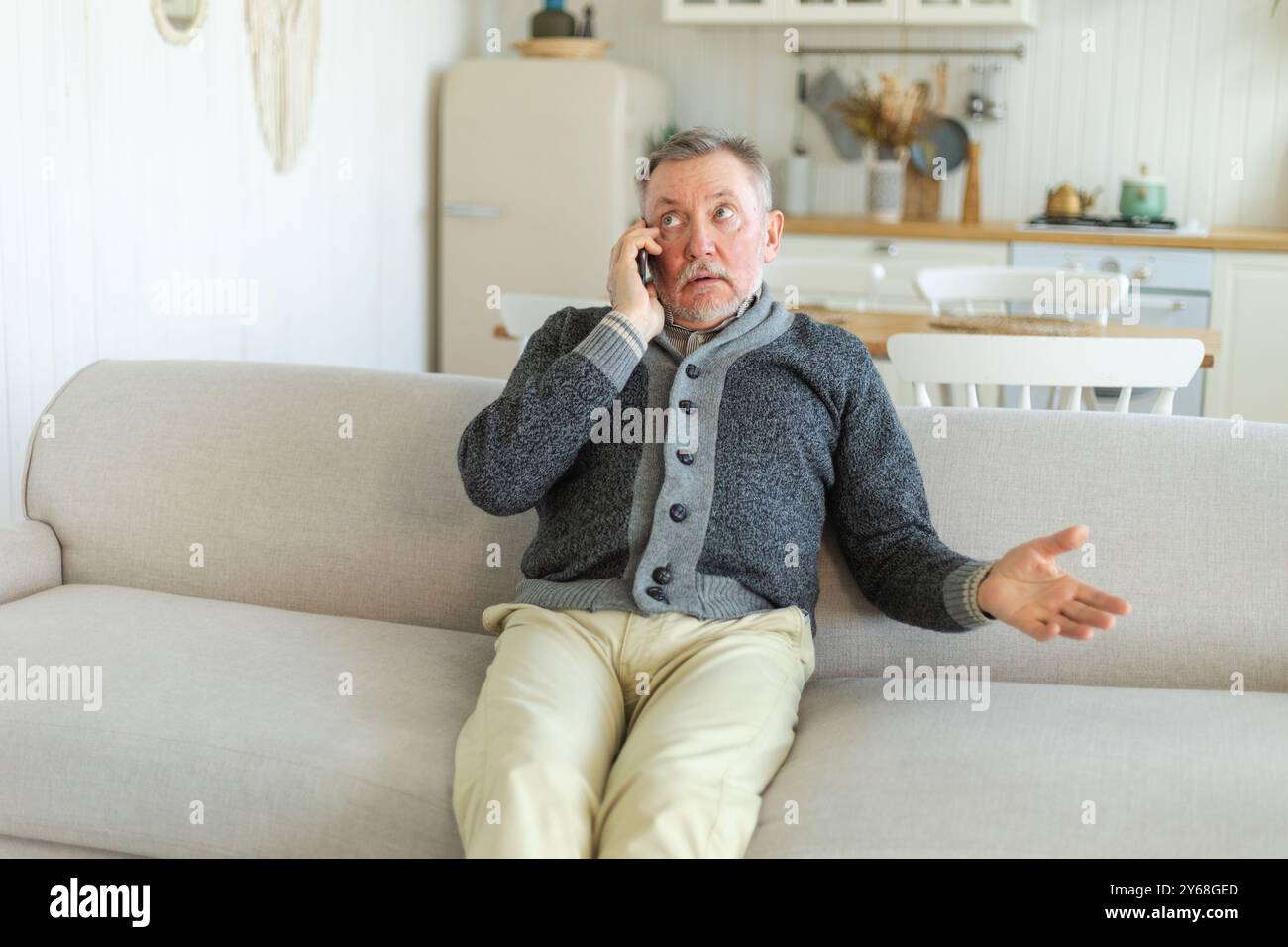 Happy middle aged senior man talking on smartphone with family friends ...