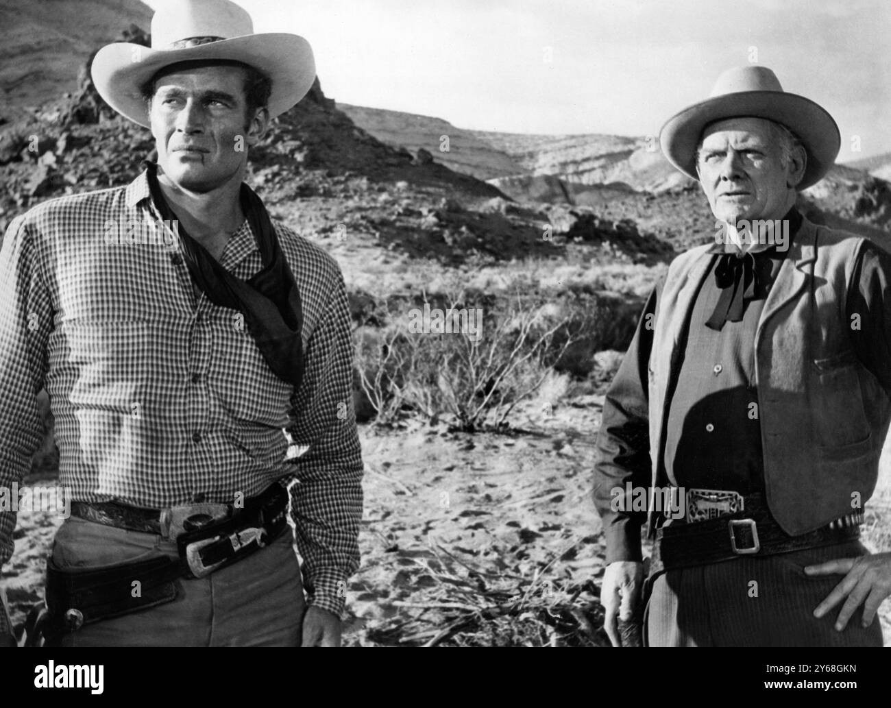 Charlton Heston, Charles Bickford, on-set of the western film, "The Big ...