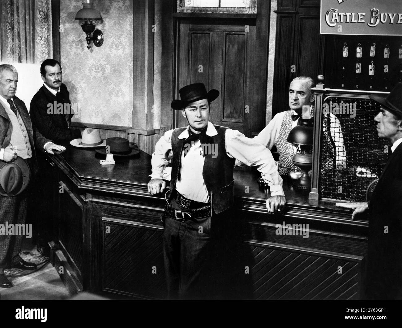 Alan Ladd (center), on-set of the western film, "The Big Land", Warner ...