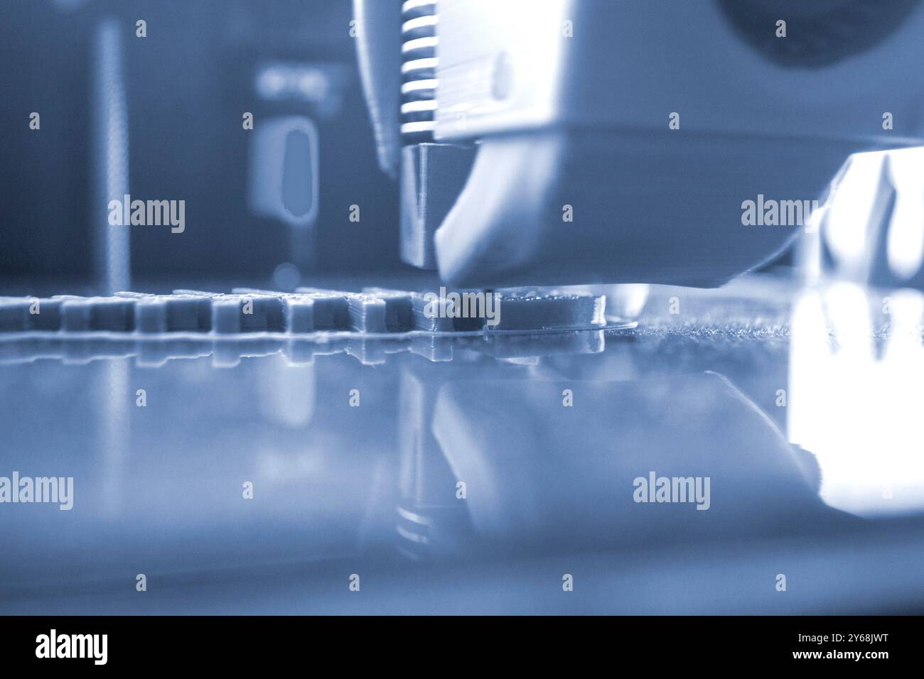 3D printer close up. A working 3D printer in process of printing object ...