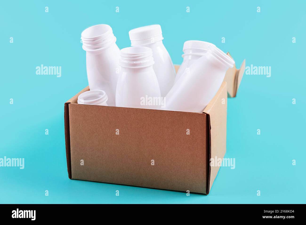 Plastic bottles arranged inside a cardboard box Stock Photo - Alamy