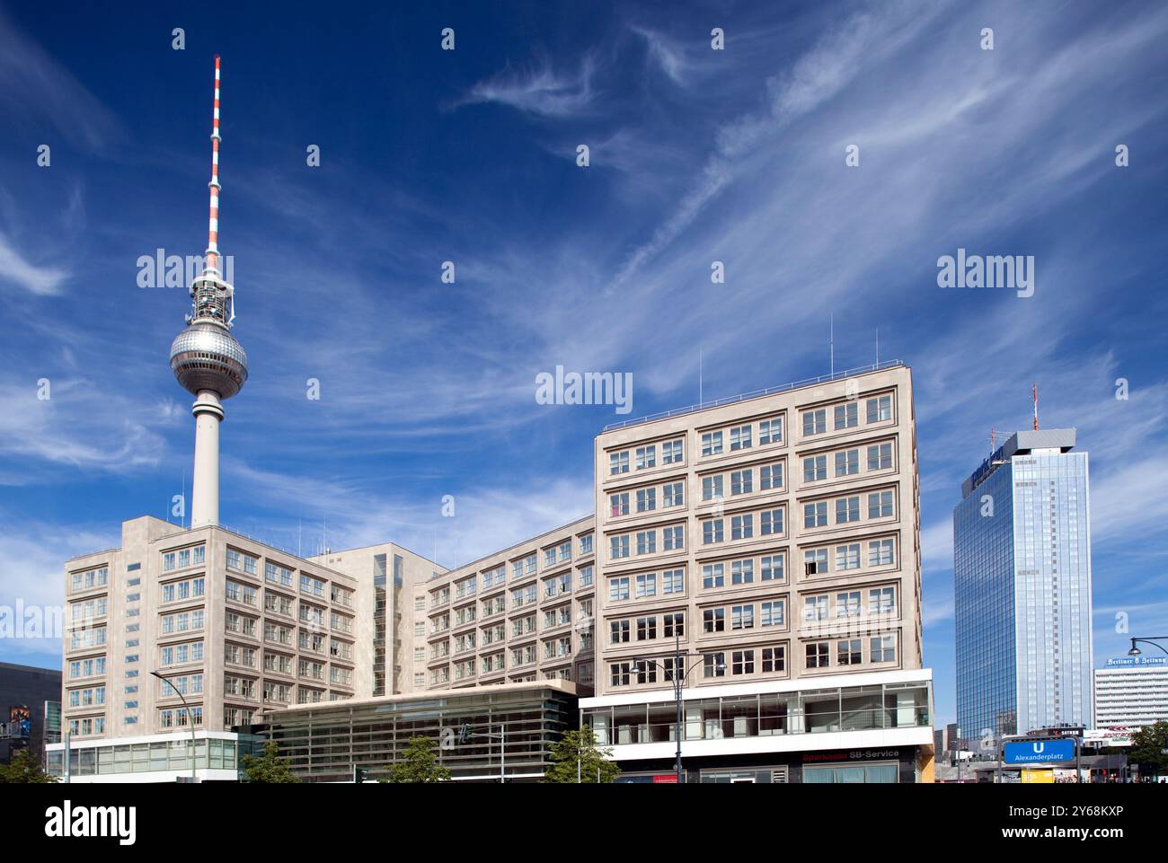 Visitors admire the iconic landmarks at Alexanderplatz square in Berlin ...