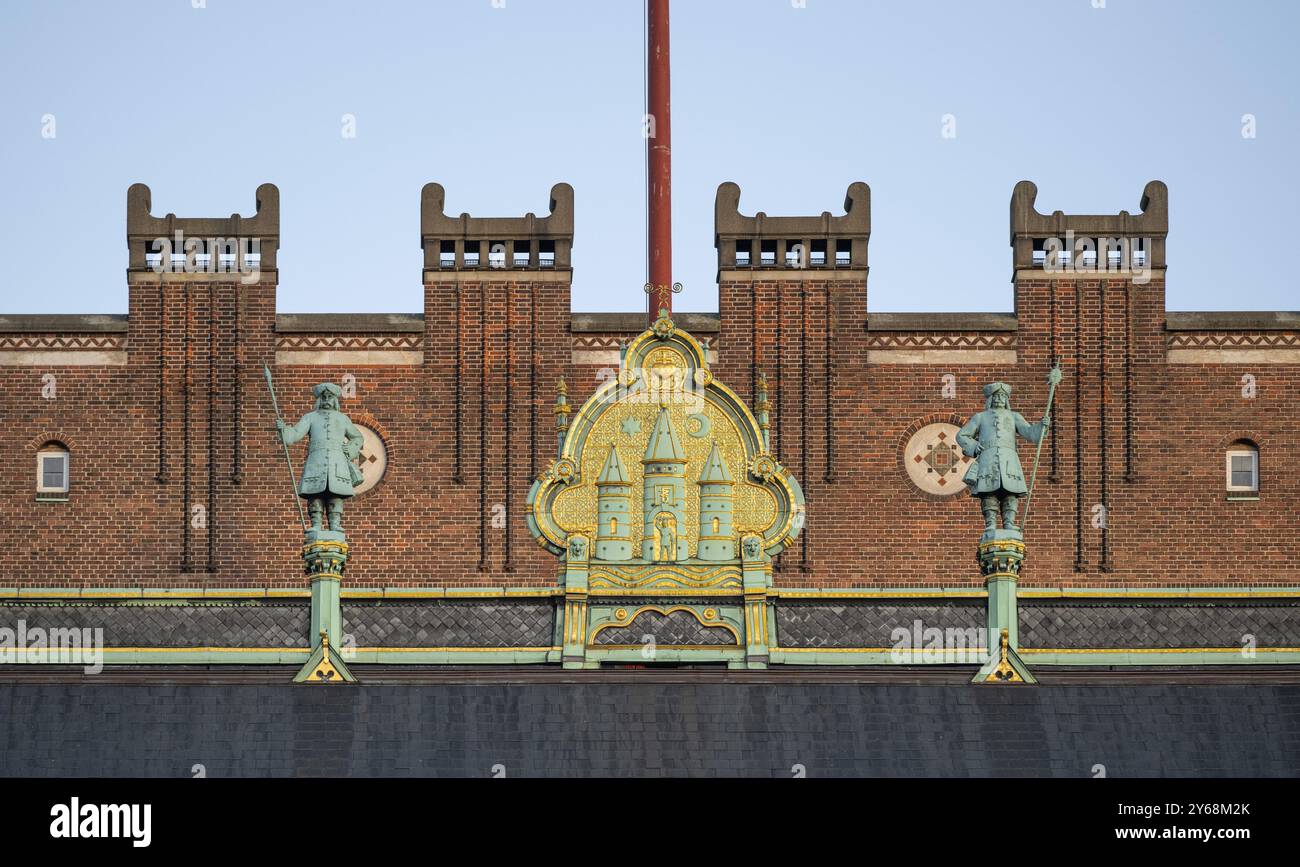 Brick facade with gilded city coat of arms, town hall in the National ...
