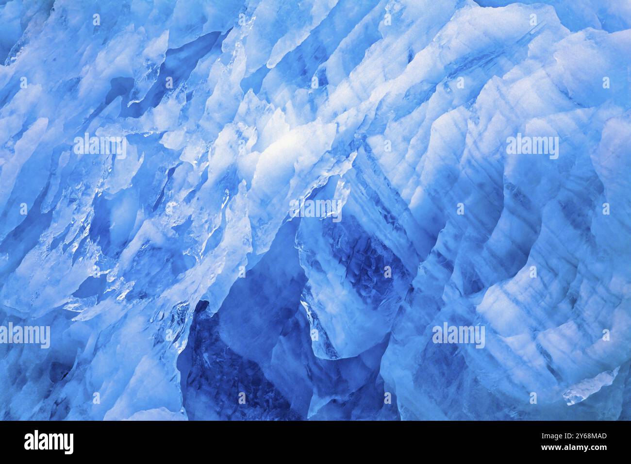Blue ice patterns on a glacier wall in the arctic, Svalbard, Norway ...