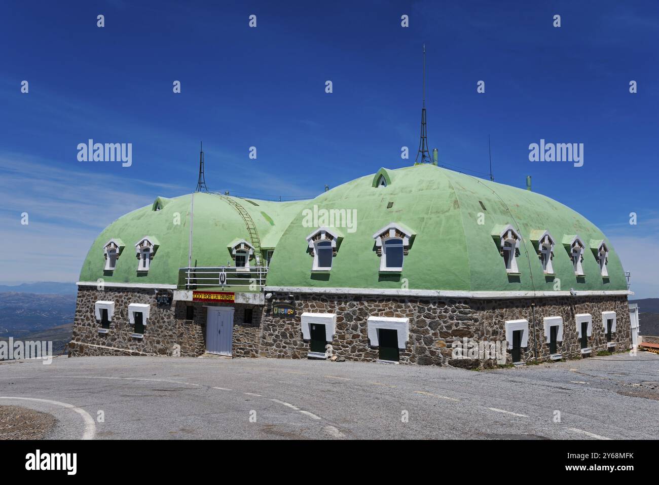 Building with green domed roof and stone facade, surrounded by ...
