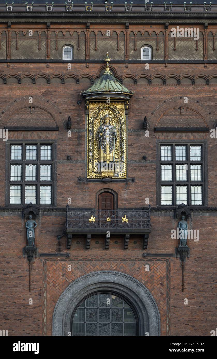 Brick facade with gilded sculpture of Bishop Absalon, St City Hall in ...