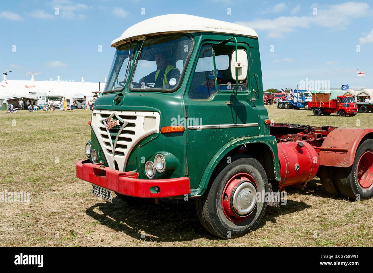 A 1971 green Foden lorry tractor unit drives around the display ring at ...