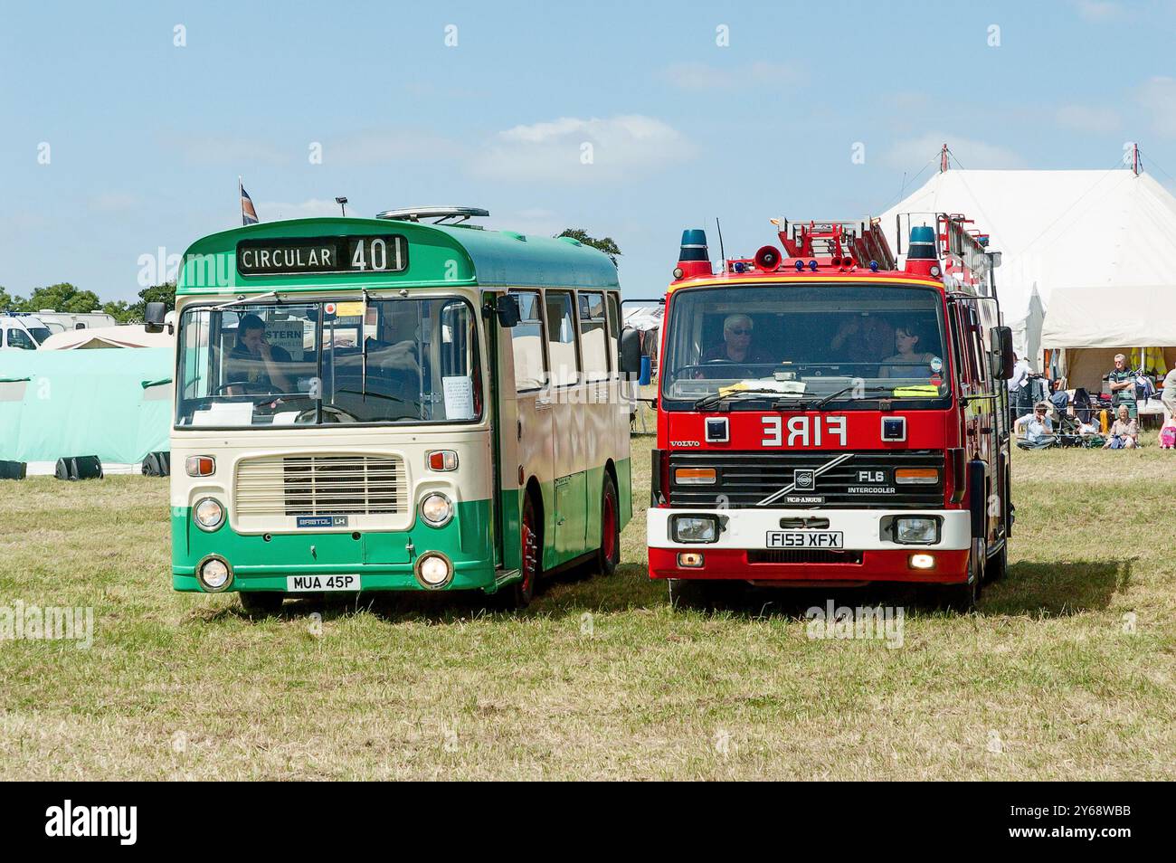 A 1976 Bristol (BLMC) bus parks next to a 1989 Volvo fire and rescue ...