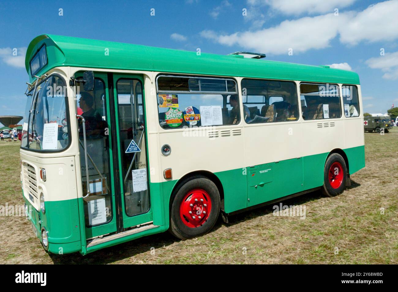 A vintage 1976 Bristol (BLMC) mini bus drives around the display ring ...