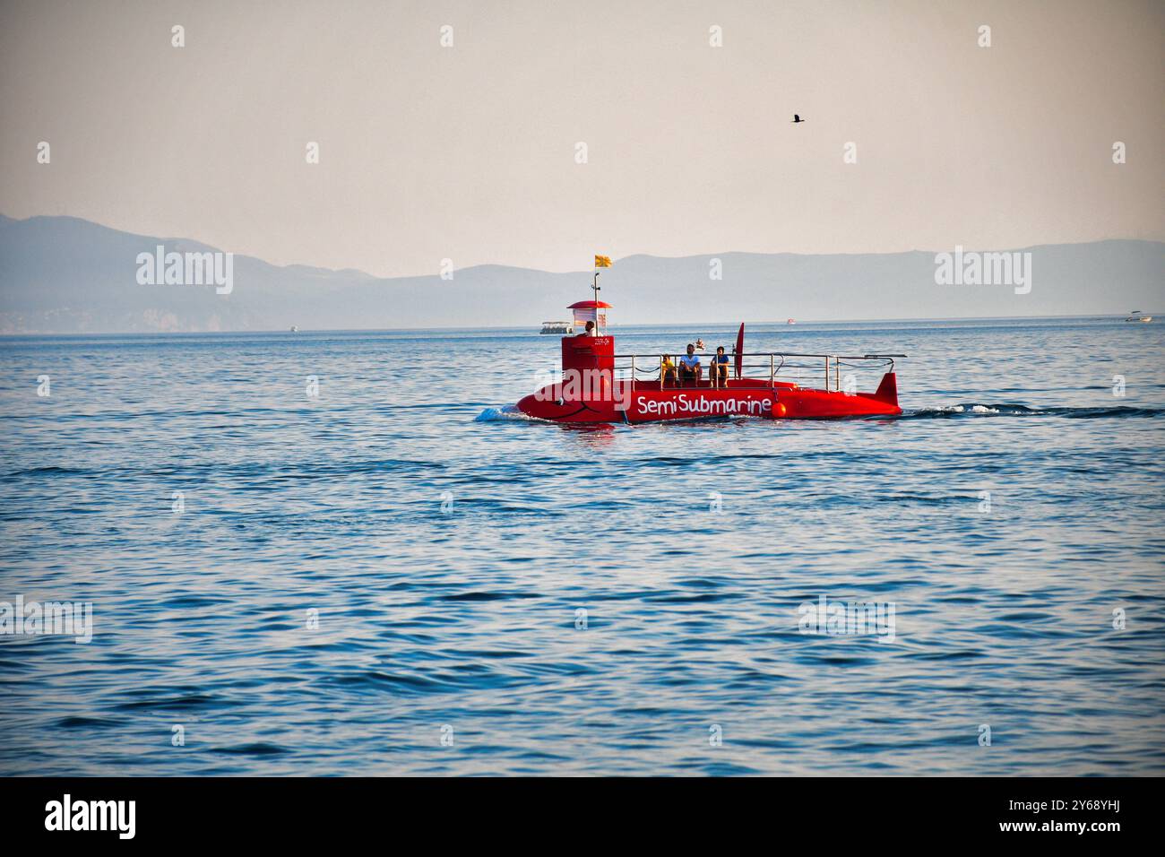 Boats of different sizes transport tourists through the waters of Lake ...