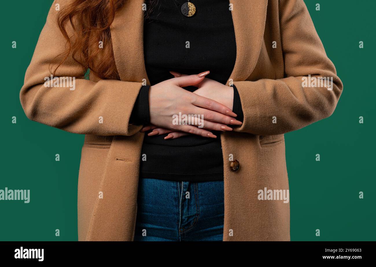Businesswoman squeezing belly with hands. abdominal pain, suffering ...