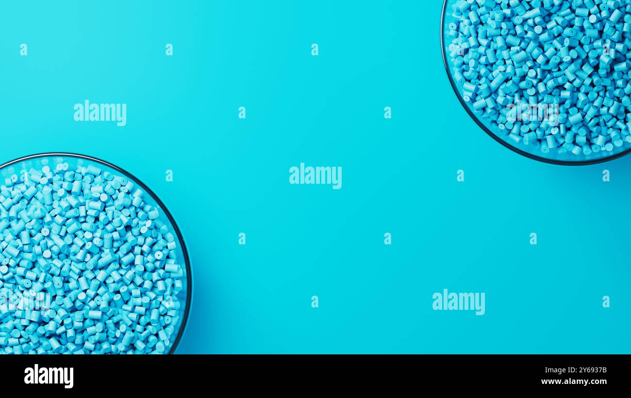 Top view on two glass cups with cyan plastic polypropylene granules ...
