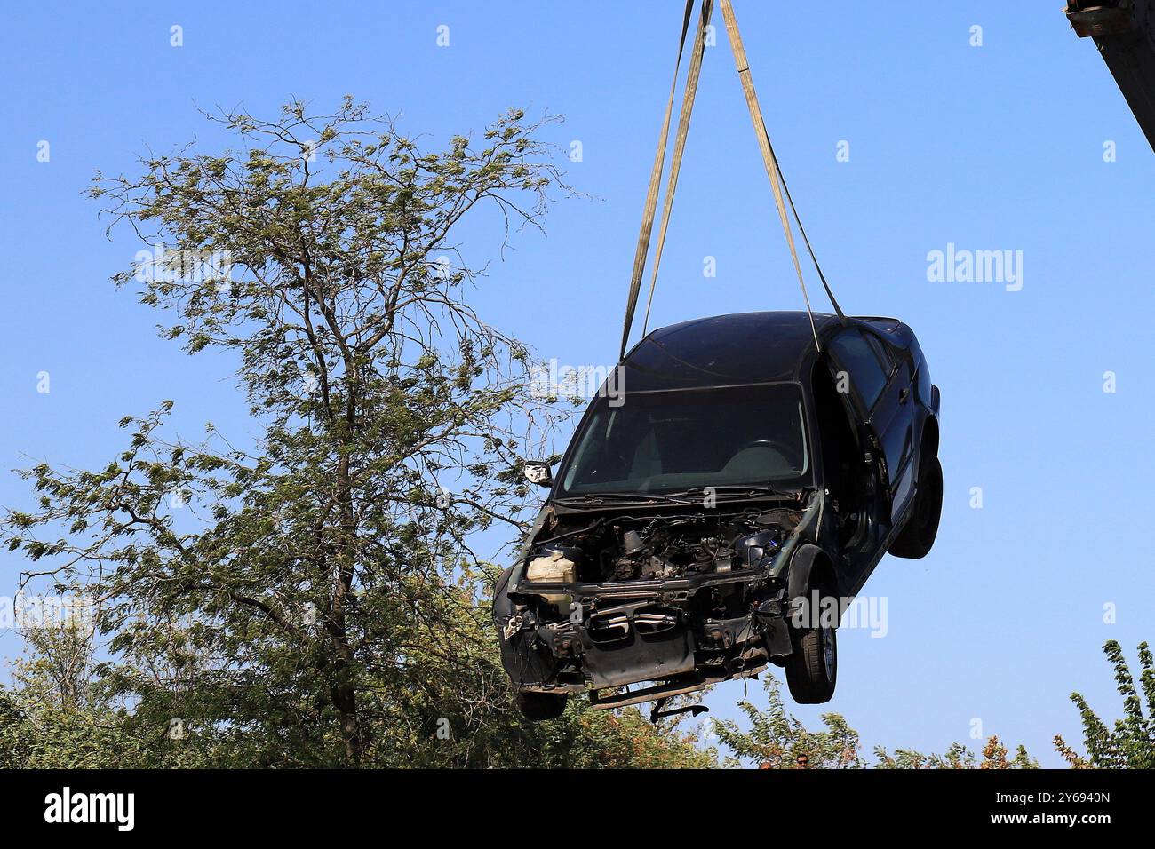 Crane moves a wrecked car after an accident. Car accident, car ...