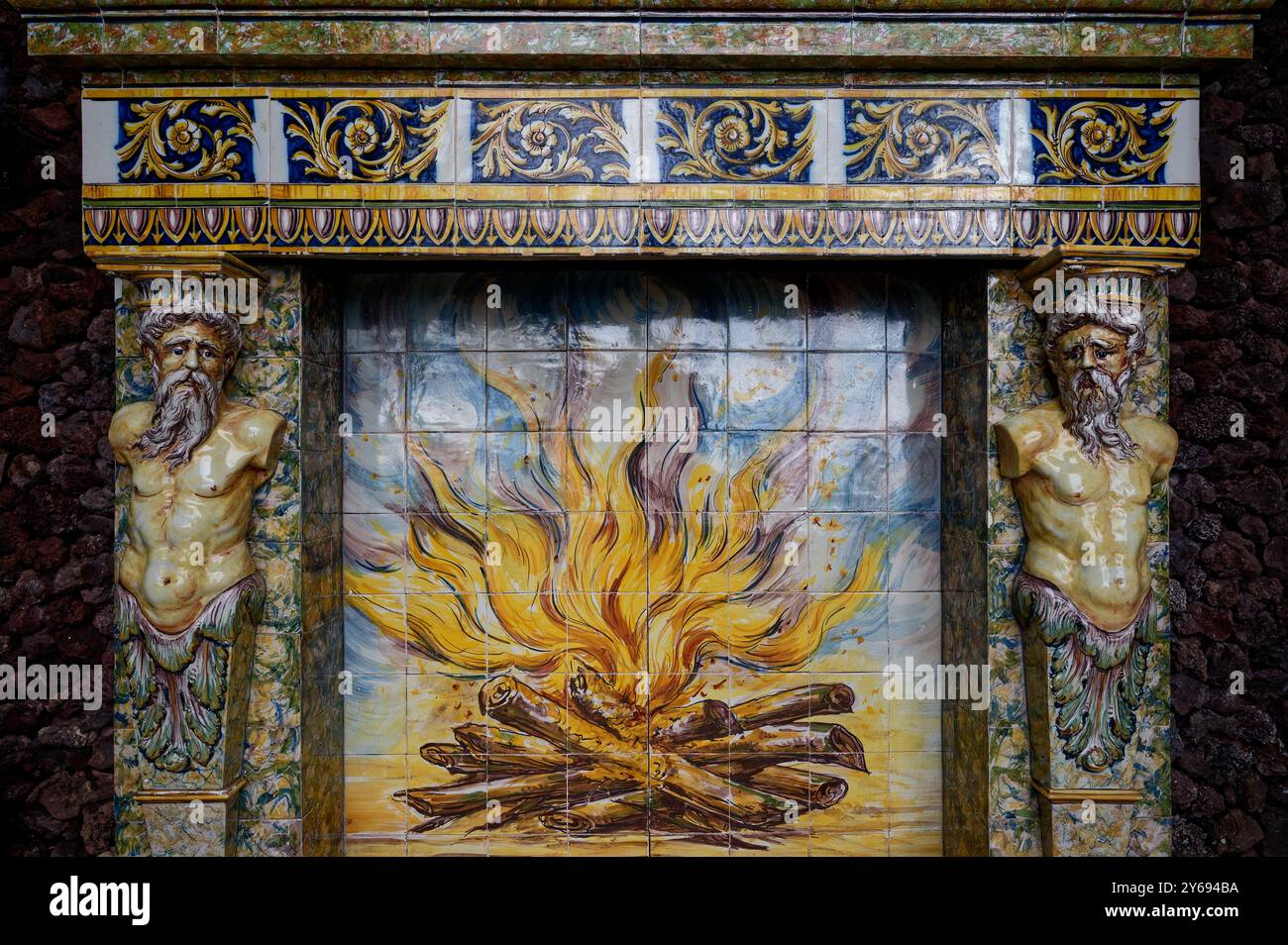 Ornate tiled fireplace with mythological figures and vibrant fire mural ...