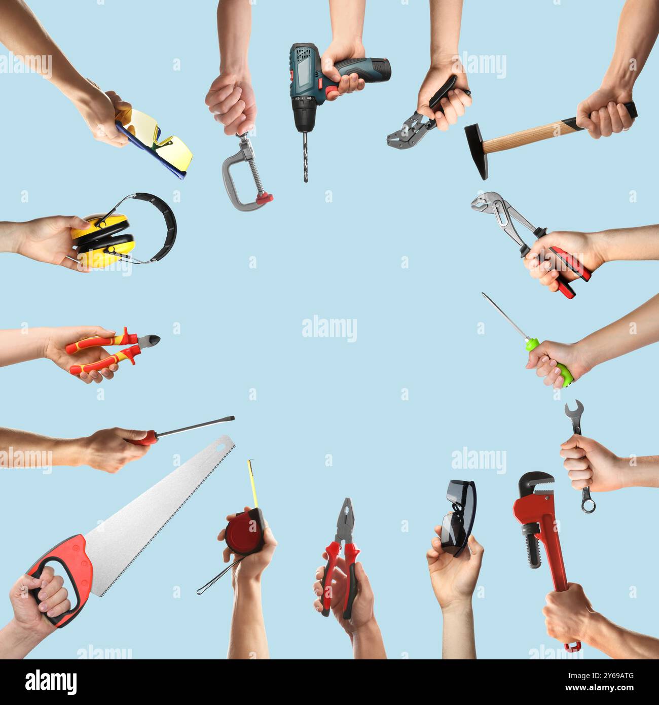 Hands of people with different tools on light blue background Stock ...