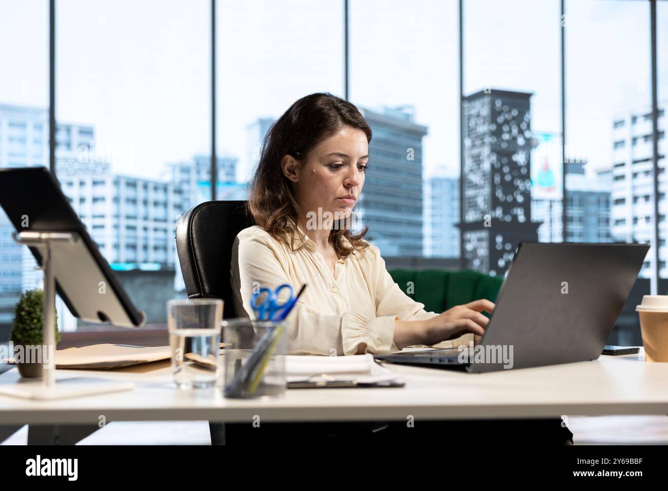 Ambitious businesswoman demonstrating her leadership skills, focusing ...