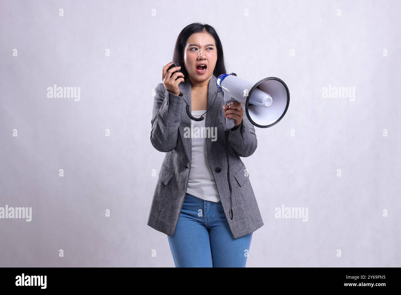 beautiful girl screaming formal angry candid hand holding loudspeaker ...