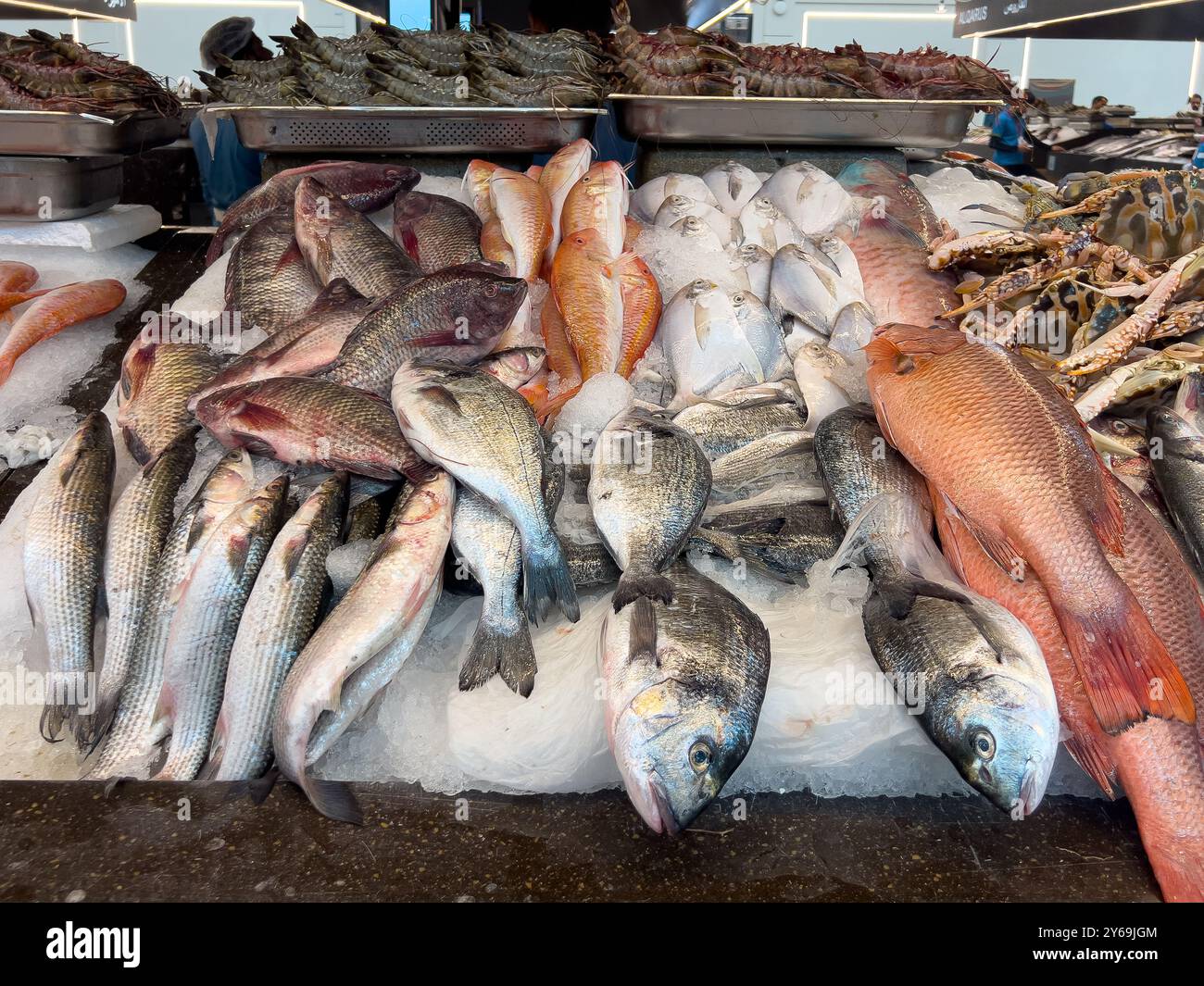 Fish market counter in Mina Abu Dhabi Stock Photo - Alamy