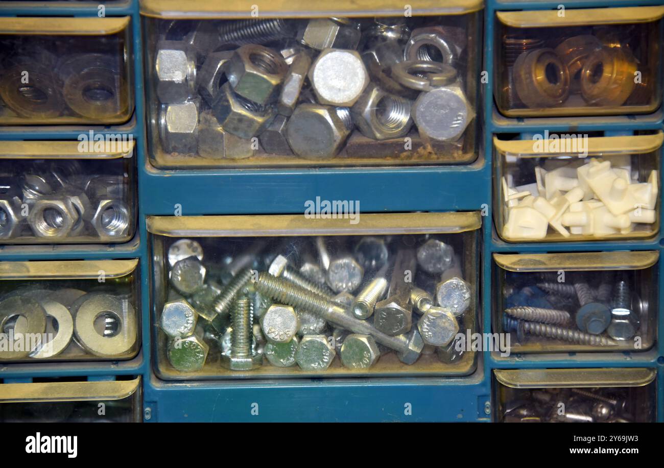 Blue plastic organizer holders drawers of nuts, bolts, screws, and ...