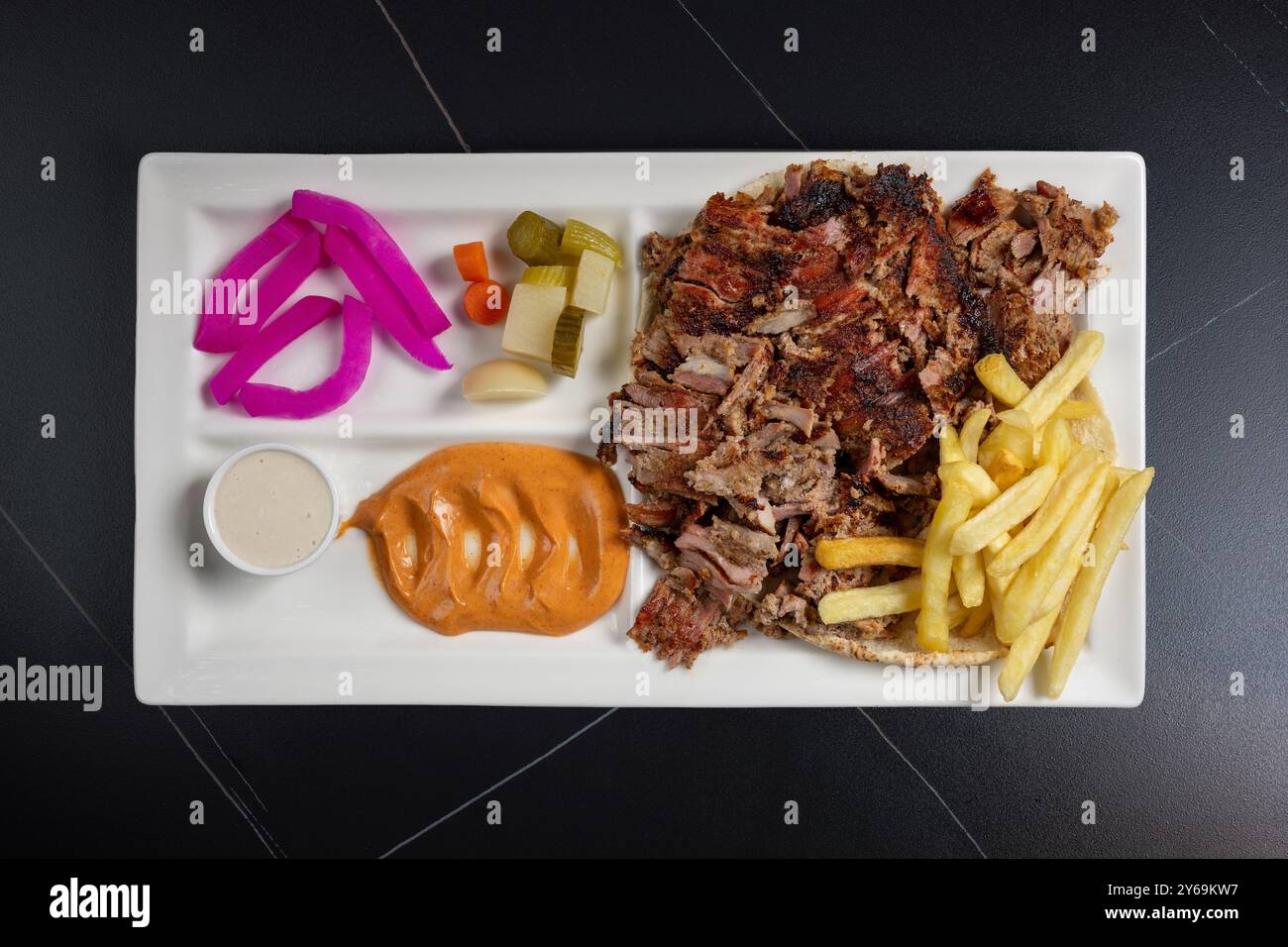 beef Shawarma plate served with fries, pickles and sauces, Turkish ...