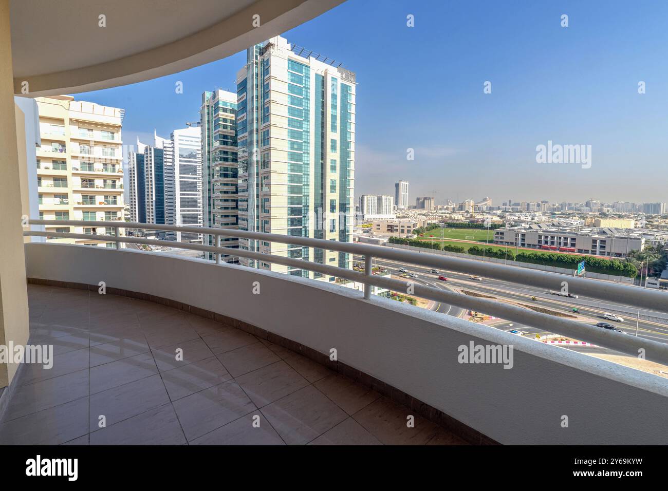View from a high-rise balcony in Dubai with tiled flooring. Below is a ...