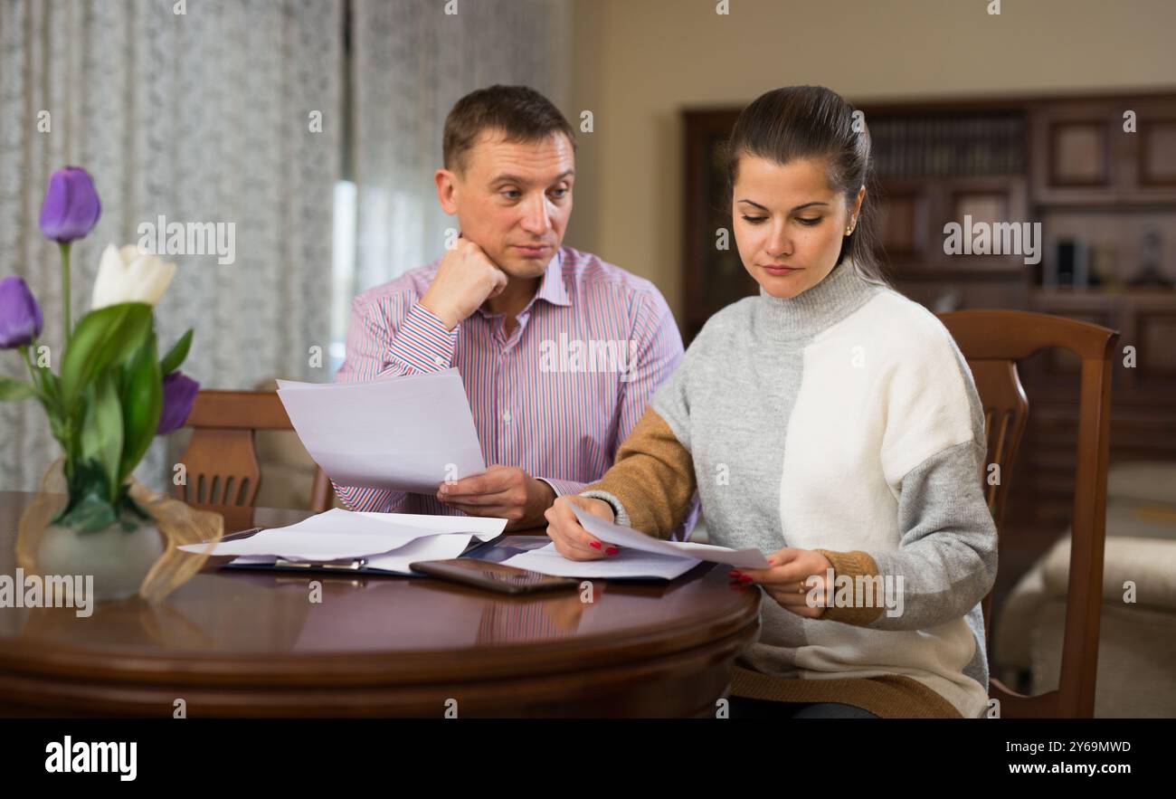 Woman filling out papers hi-res stock photography and images - Alamy