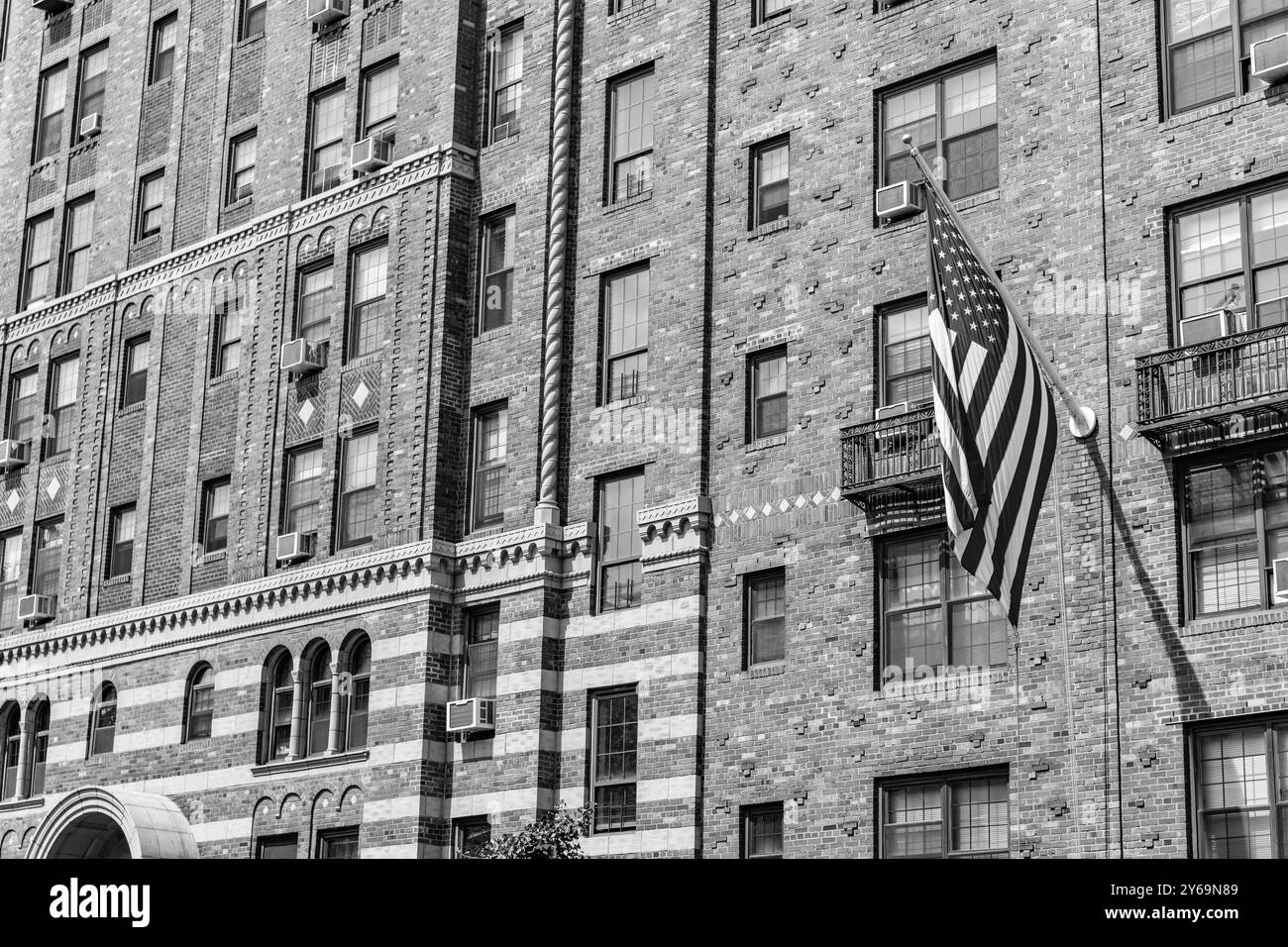 american flag on brick brownstone building. architectural exterior and ...