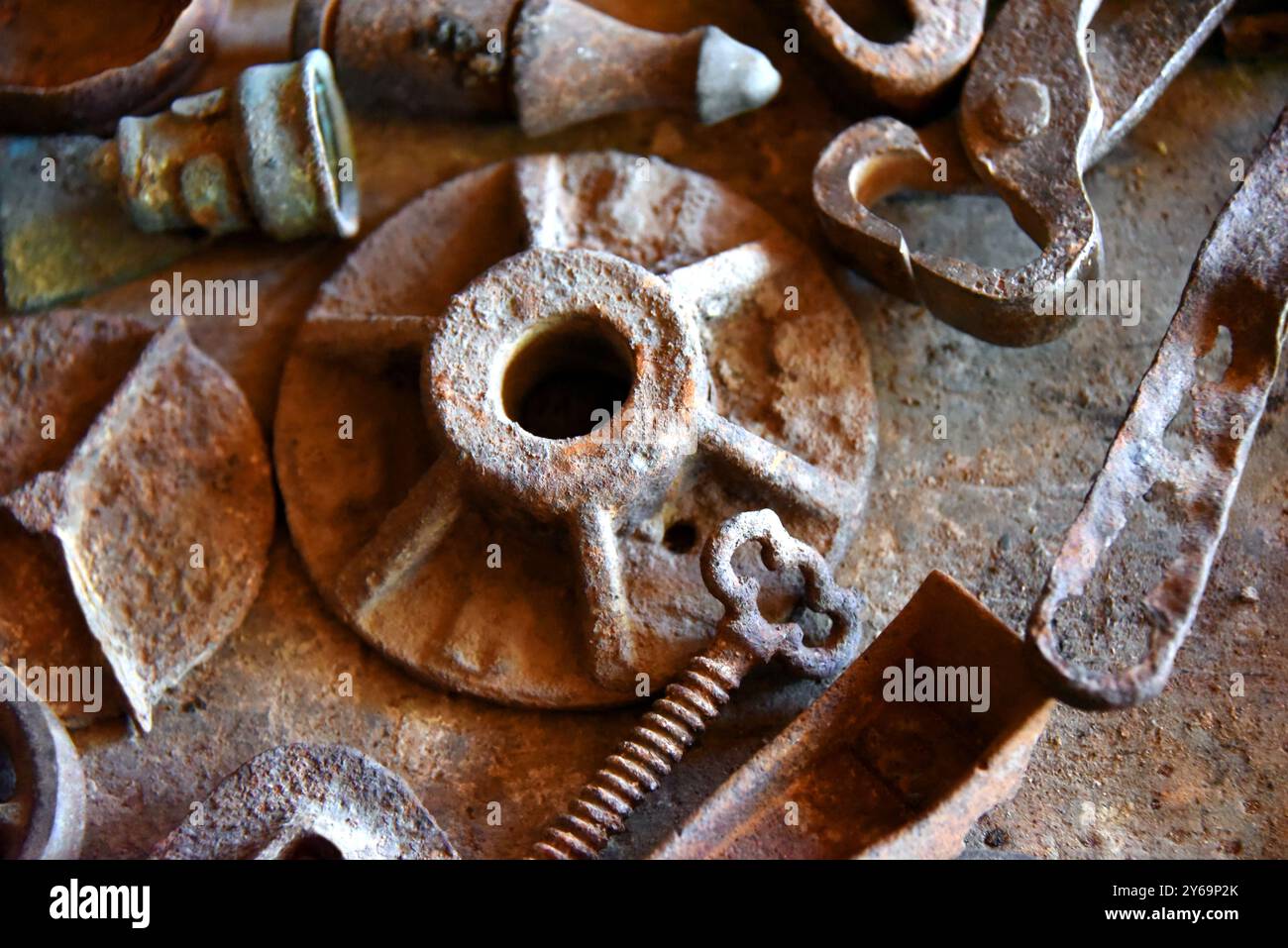 Dusty tool box has collection of antique mining tools and miscellaneous ...
