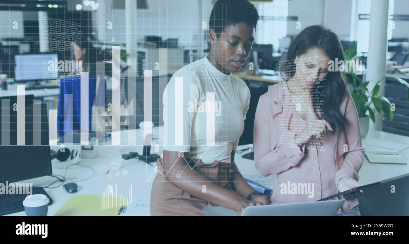 Analyzing data charts image over diverse businesswomen collaborating in office Stock Photo - Alamy