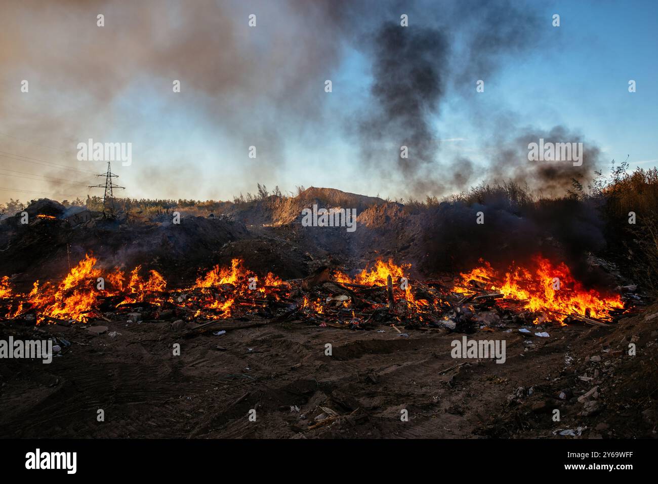 Burning garbage at landfill. Air pollution concept Stock Photo - Alamy