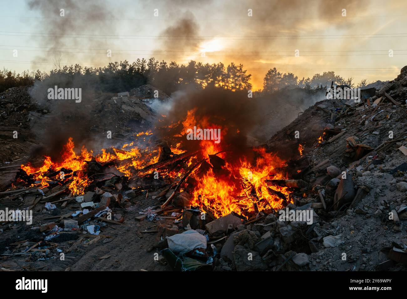 Burning garbage at landfill. Air pollution concept Stock Photo - Alamy