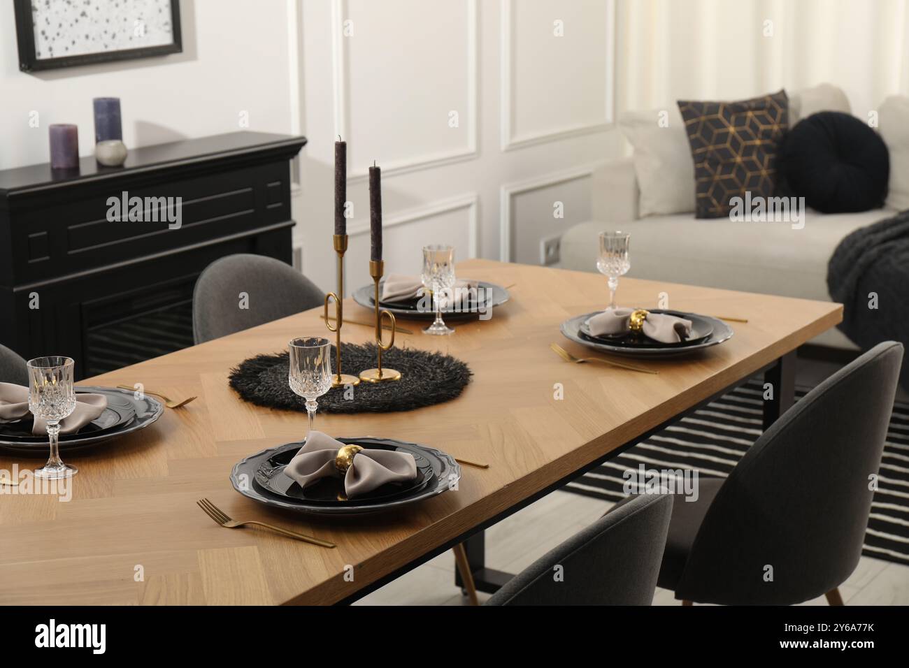 Stylish table setting with black dishware in dining room Stock Photo ...