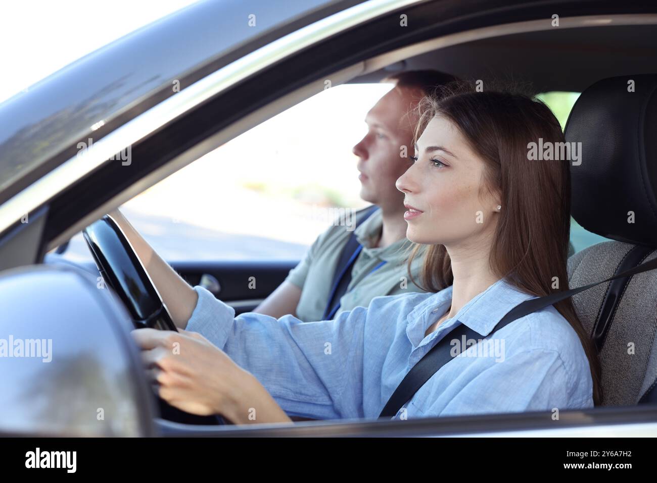 Driving school. Student passing driving test with examiner in car Stock ...