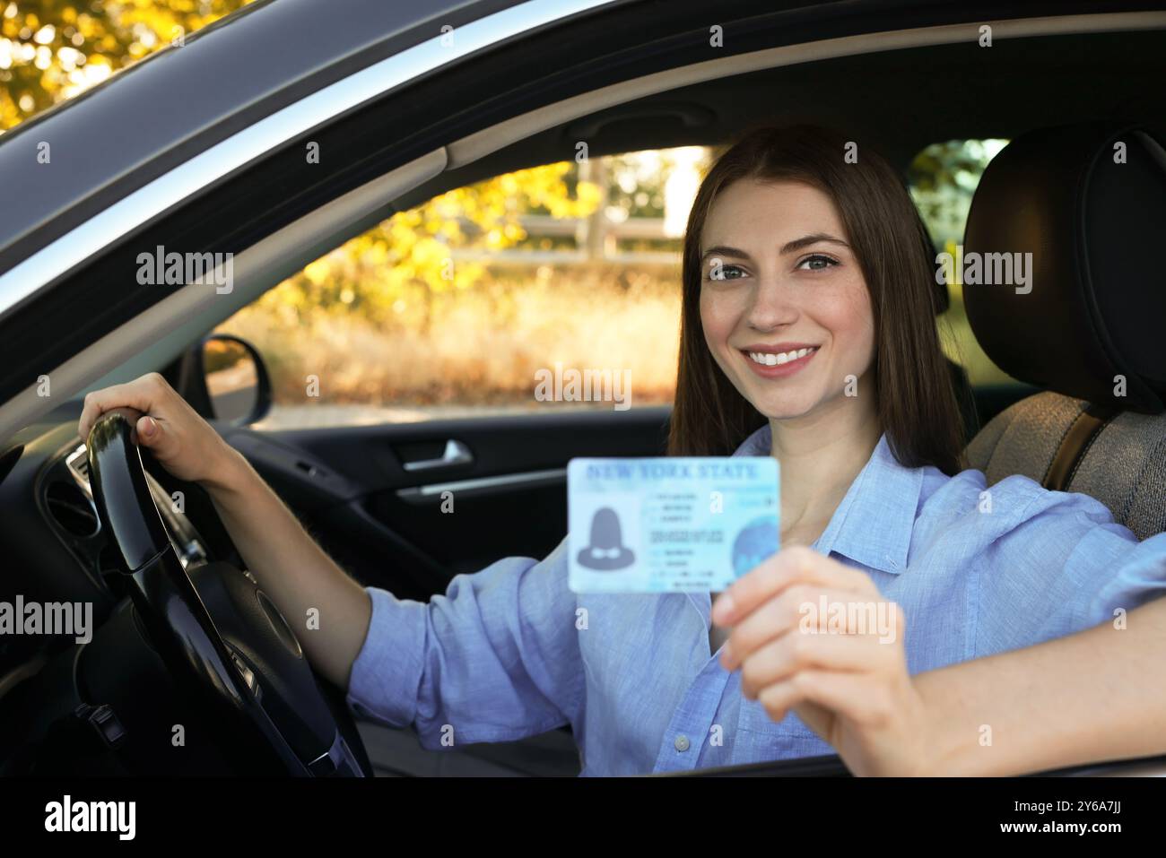 Driving school. Woman with driving license in car Stock Photo - Alamy