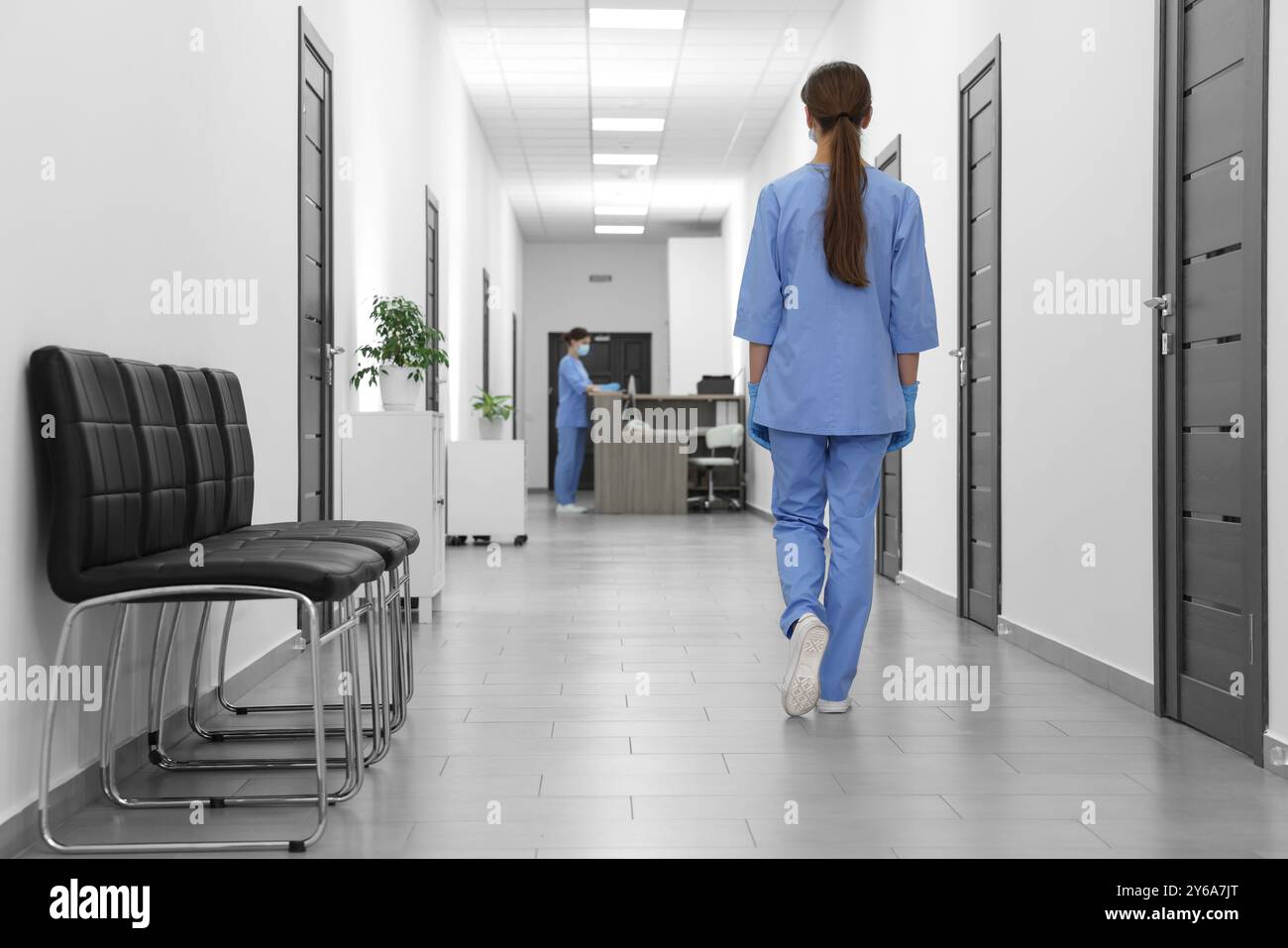 Nurse walking corridor back hi-res stock photography and images - Alamy