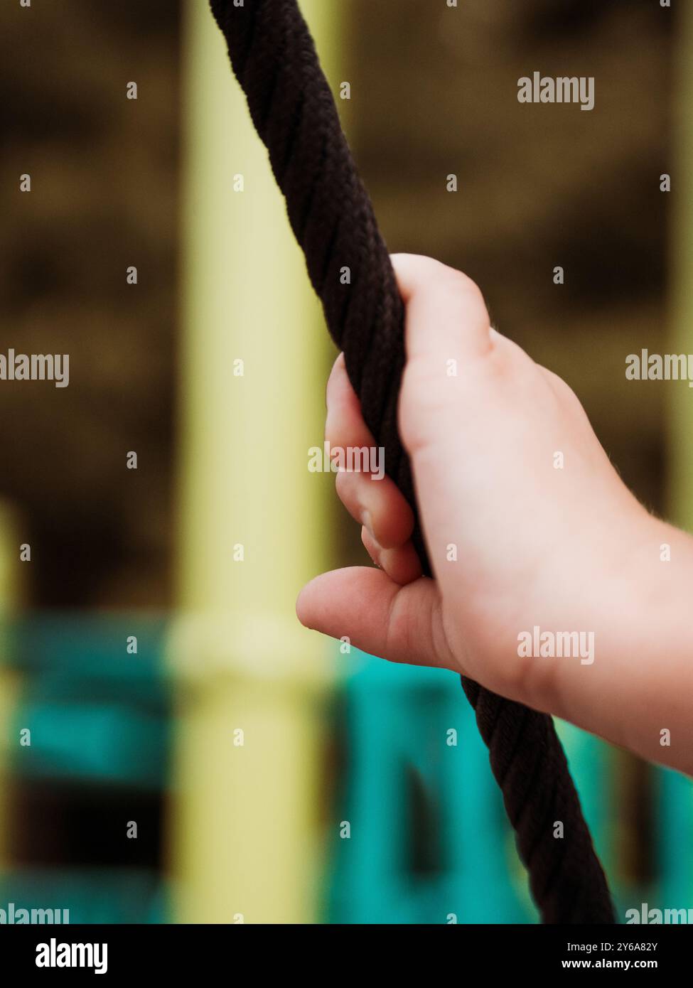 hand grabbing rope on playground in public park Stock Photo - Alamy
