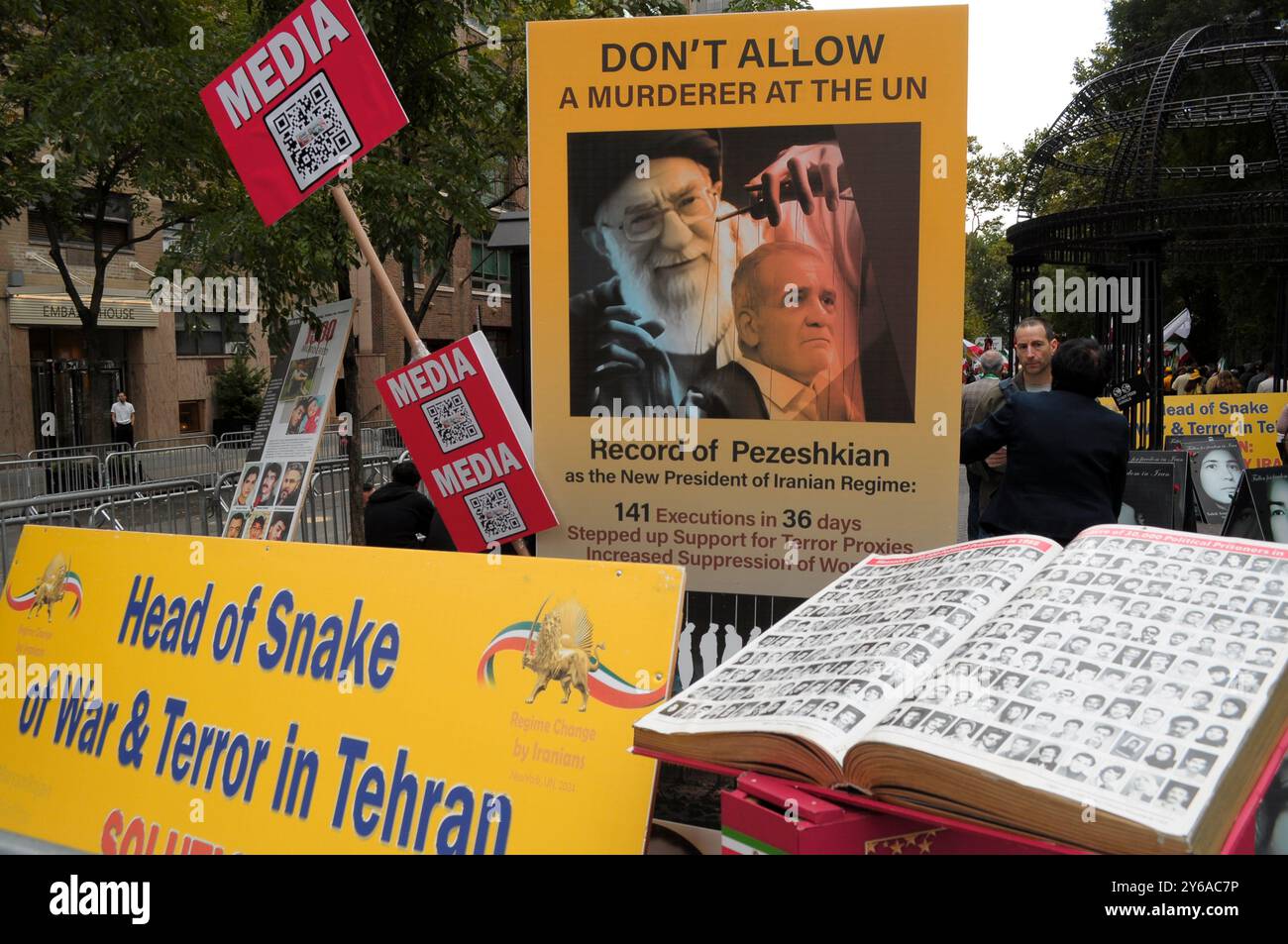 A placard criticizing Iran's supreme leader Ayatollah Ali Khamenei ...