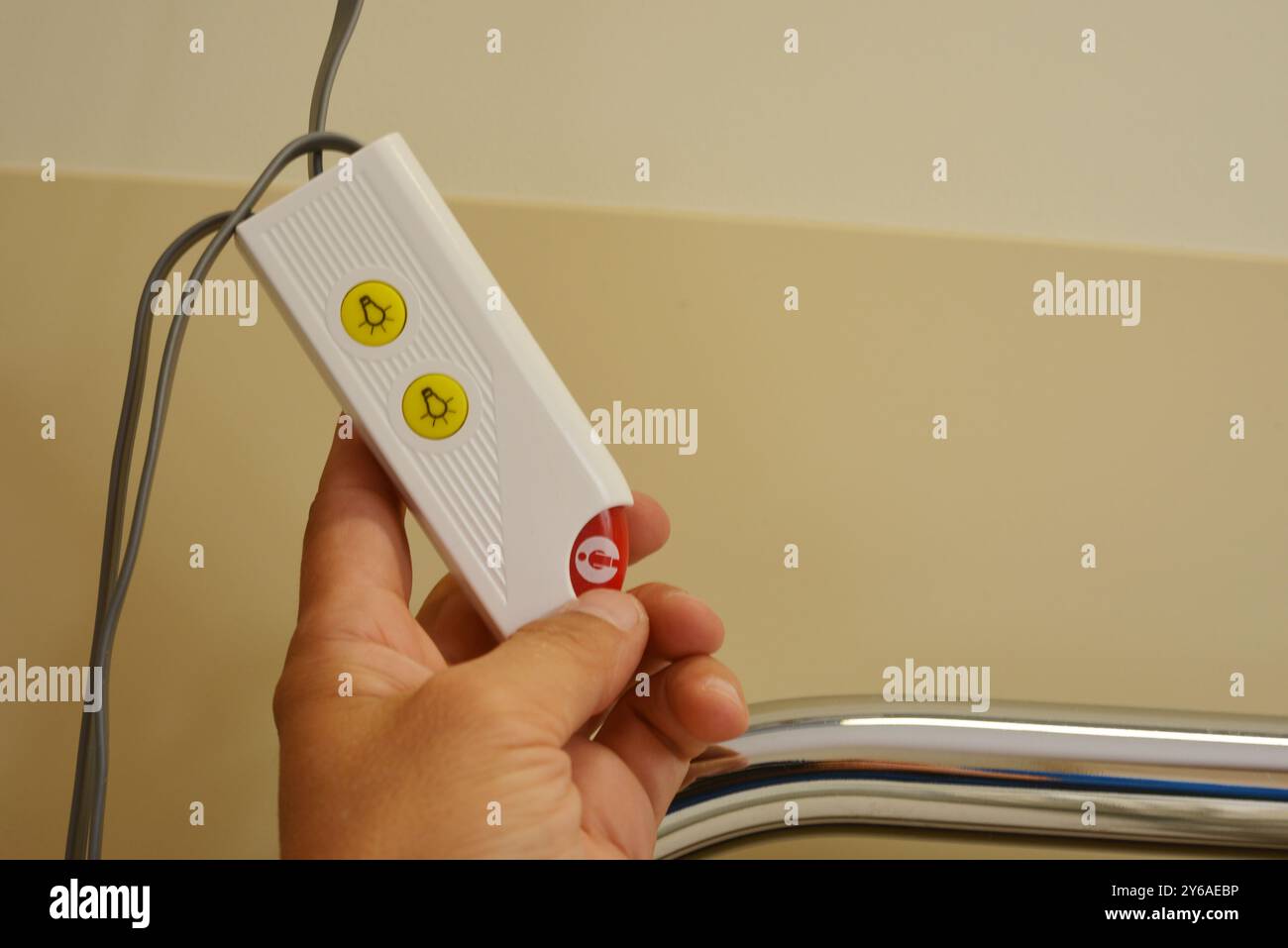 A hand holds an emergency call button to get help in the hospital Stock ...