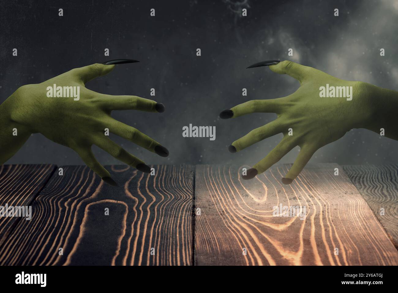 Two witches hand with long nail claw. The color is green. Evil, zombie ...