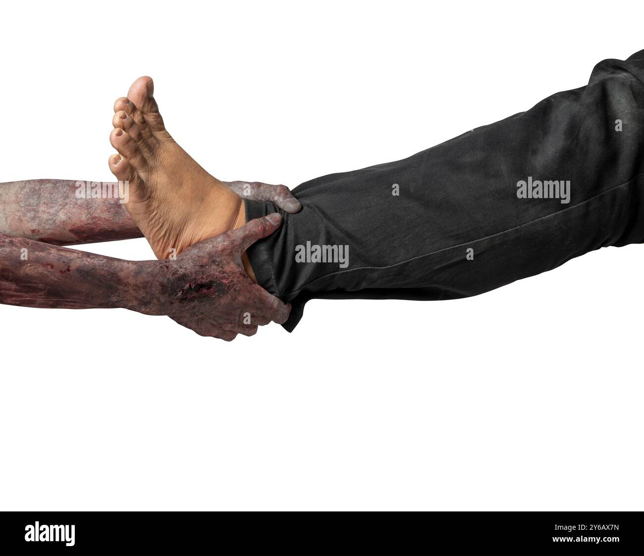 A zombie hand with a bloody wound grabs a human leg. Zombie, devil ...