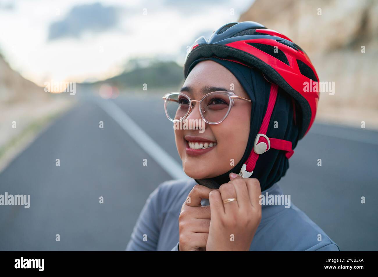 close up hijab biker wearing helmet for safety Stock Photo - Alamy