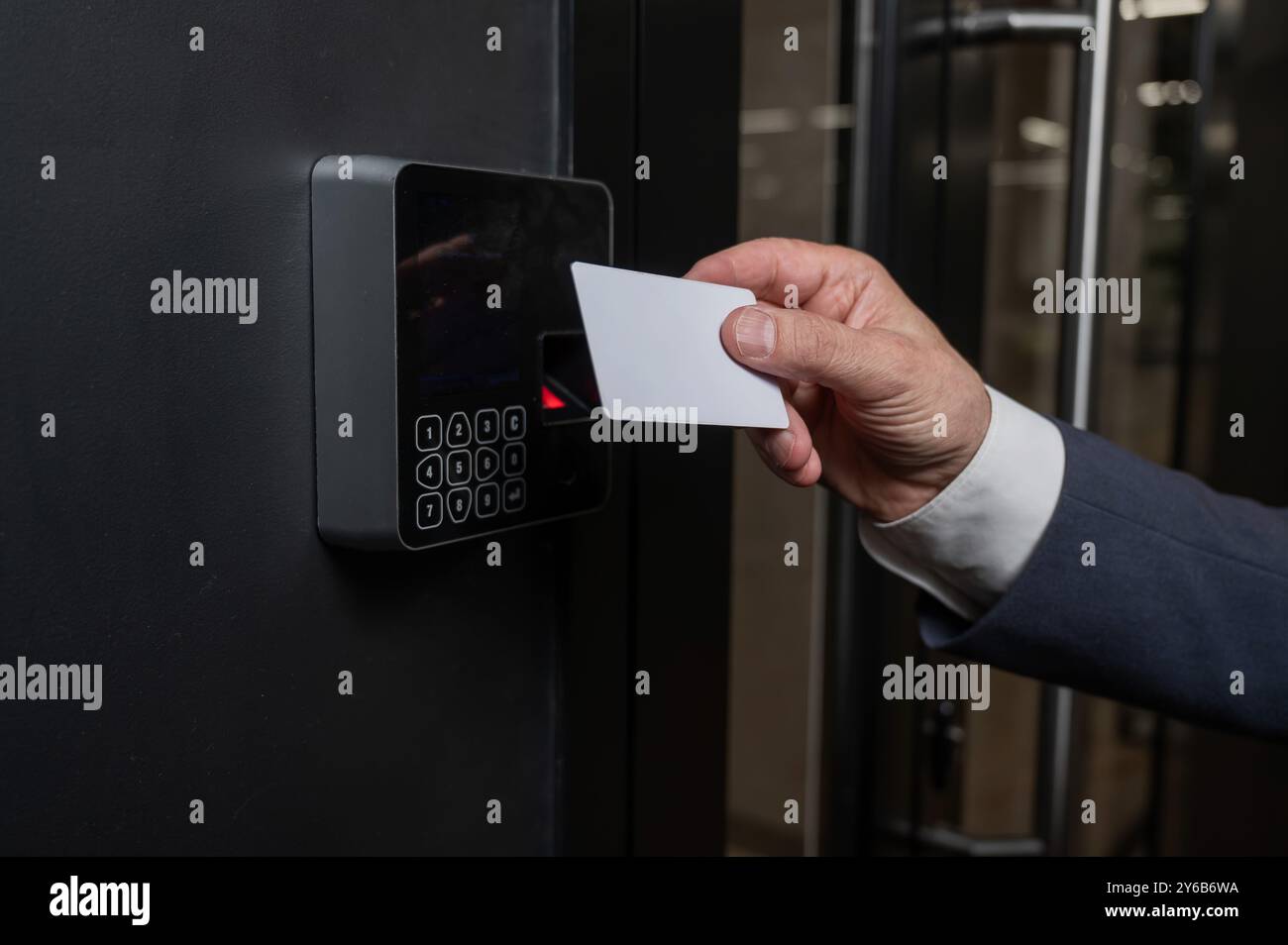 A man opens the door with a card. Modern electronic lock. Keyless Entry ...